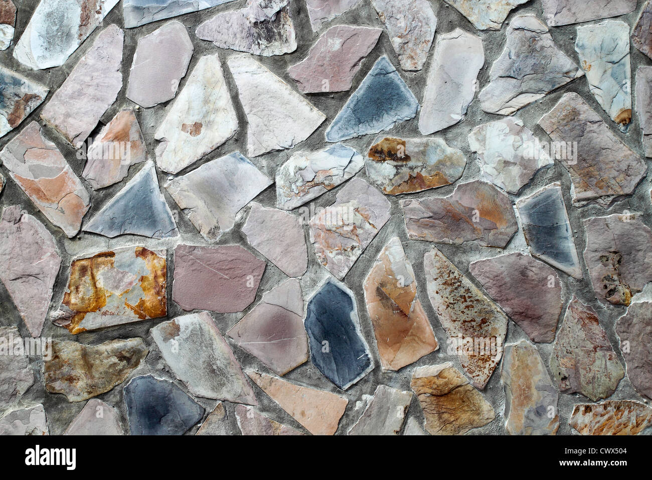 masonry wall with irregular shaped stones Stock Photo - Alamy