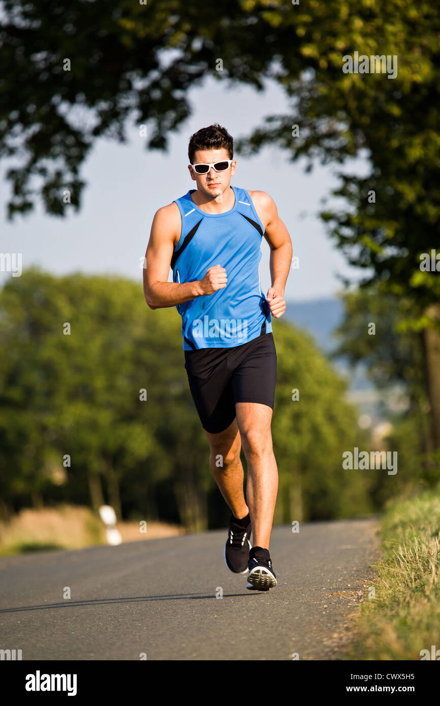 A man jogging cross country Stock Photo - Alamy