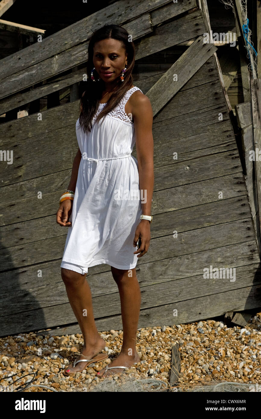 African Ebu Nigerian young woman tourist at seaside coast Stock Photo ...