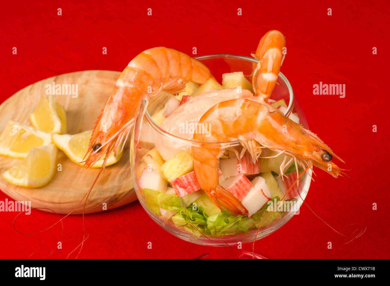 Closeup of a fresh prawn cocktail, lemon slices in background Stock ...