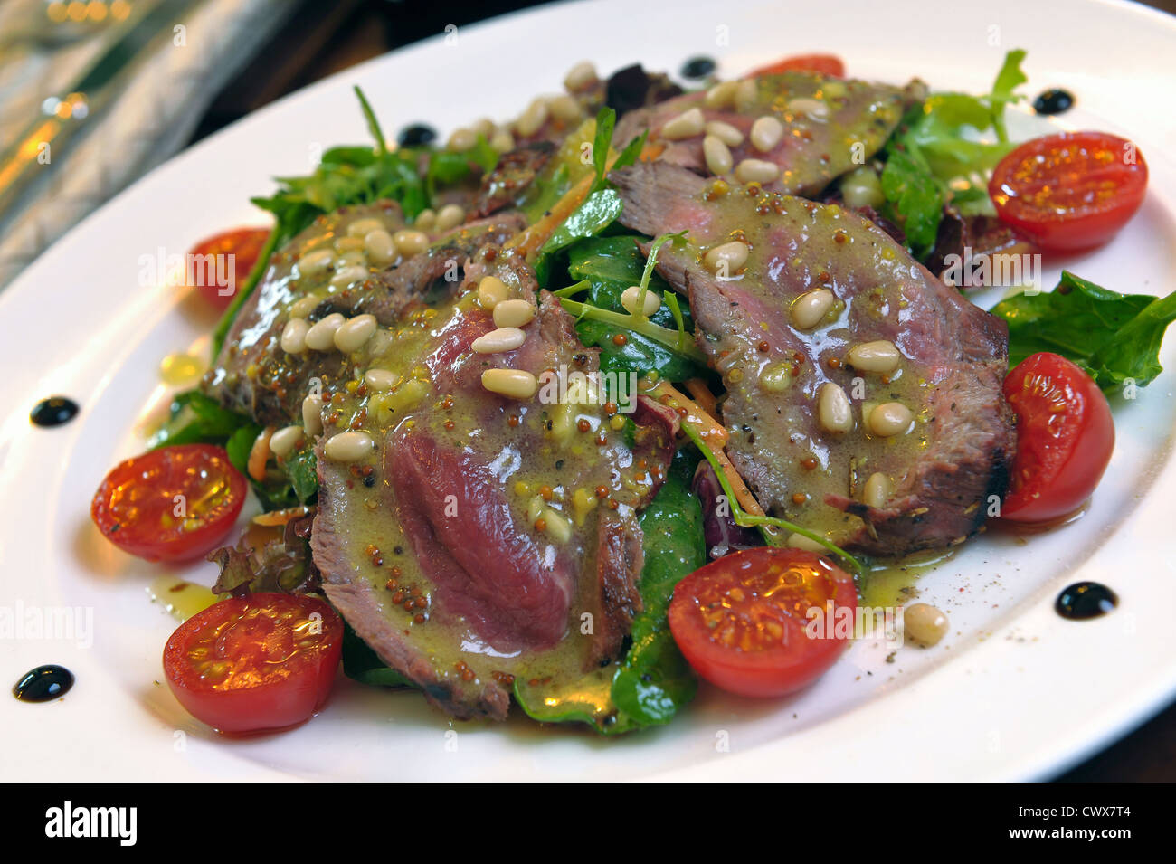 Salad of veal with a mix of salads and cedar Stock Photo - Alamy
