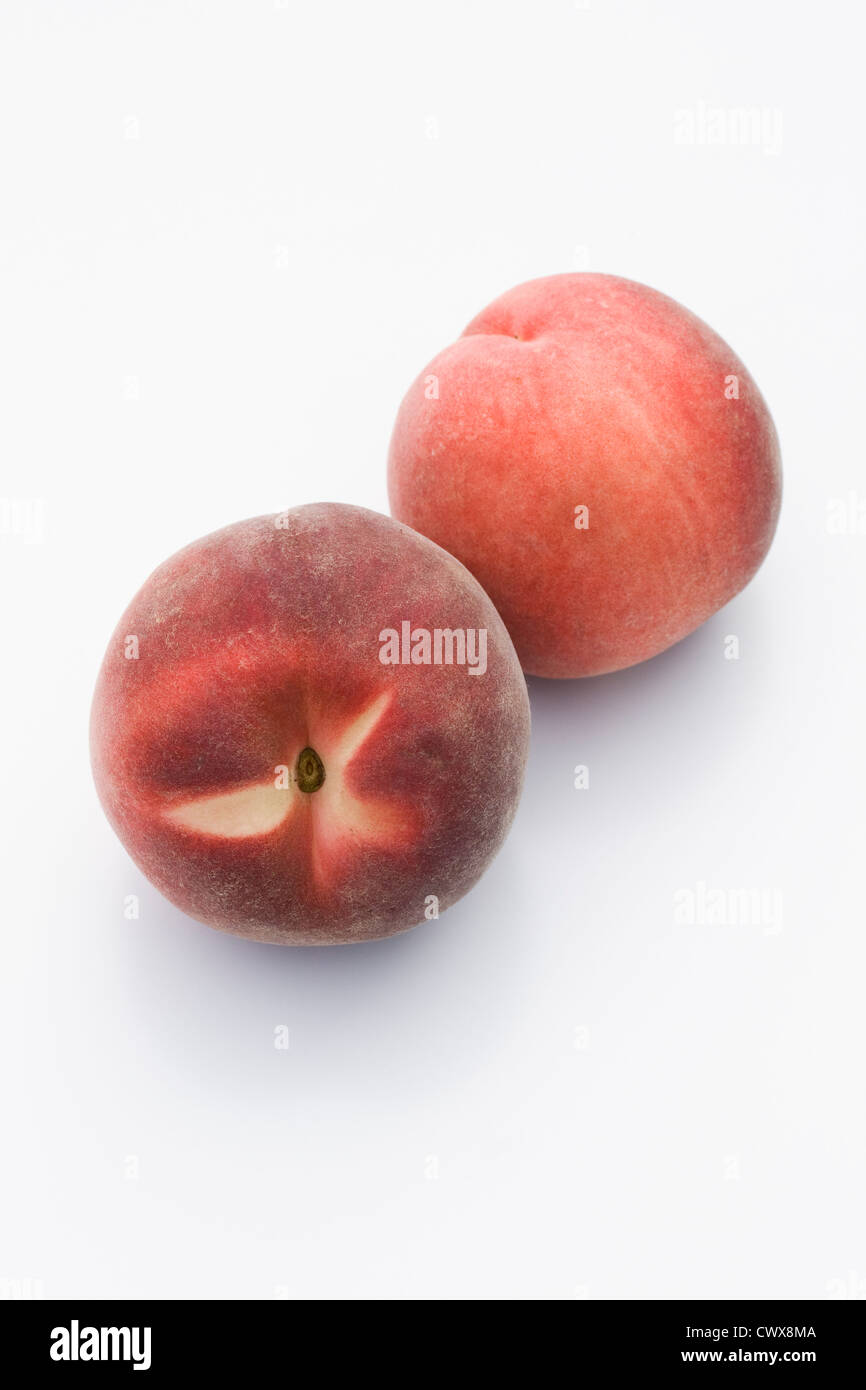 Prunus persica. White flesh peaches on a white background Stock Photo ...