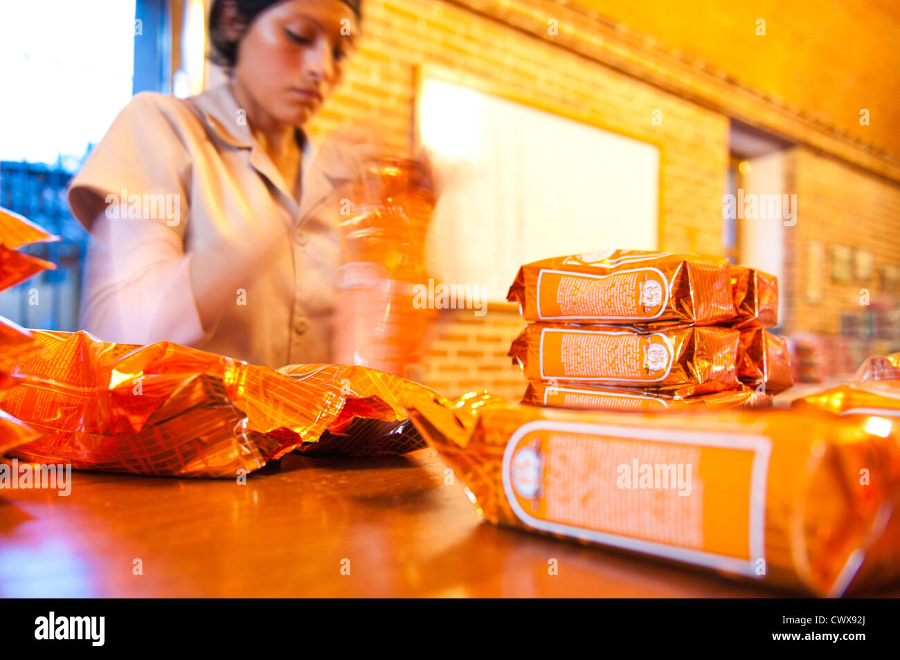 Women production factory workers packaging coffee beans at the ...