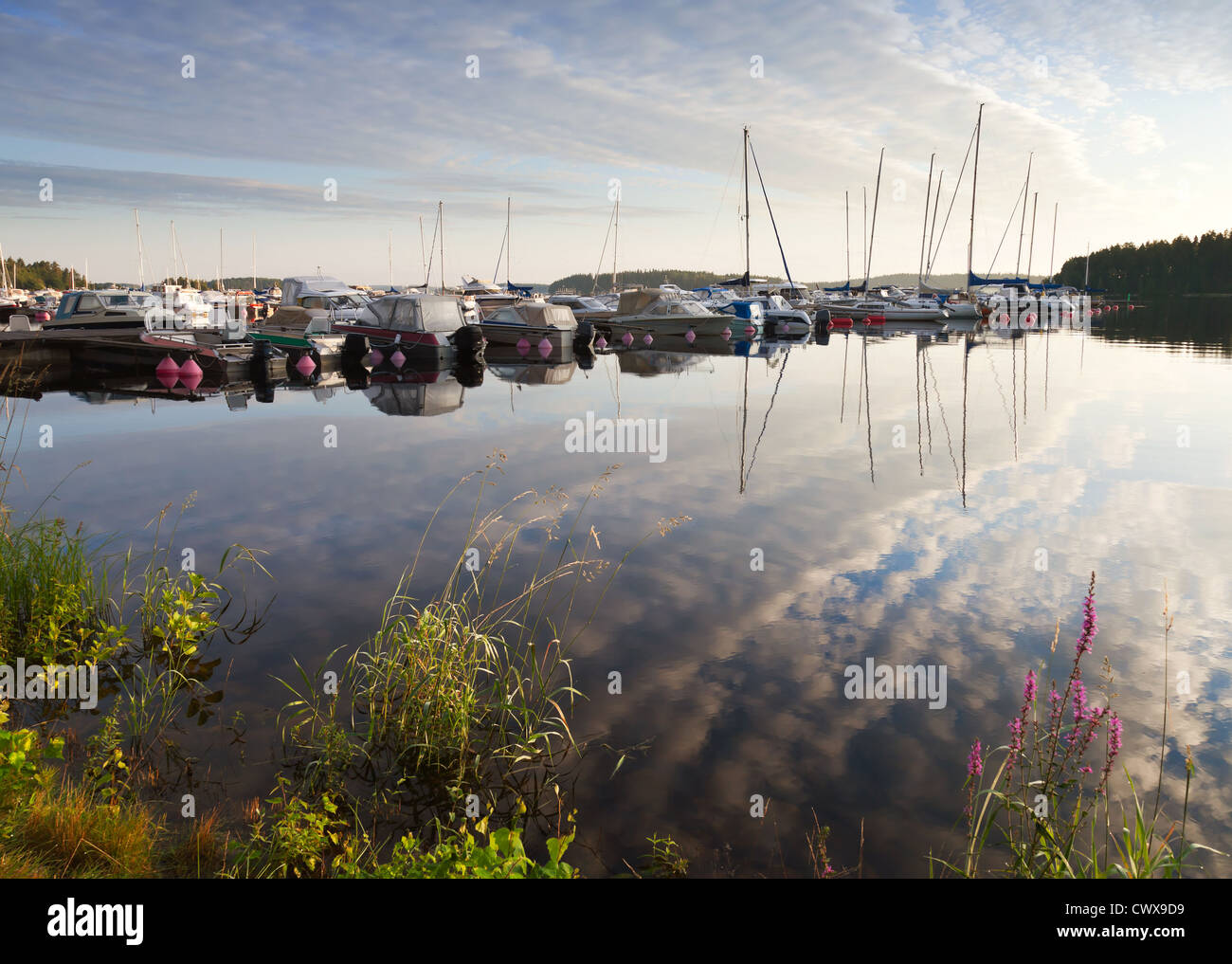 Yachts and pleasure boats moored in small European marina. Imatra town ...