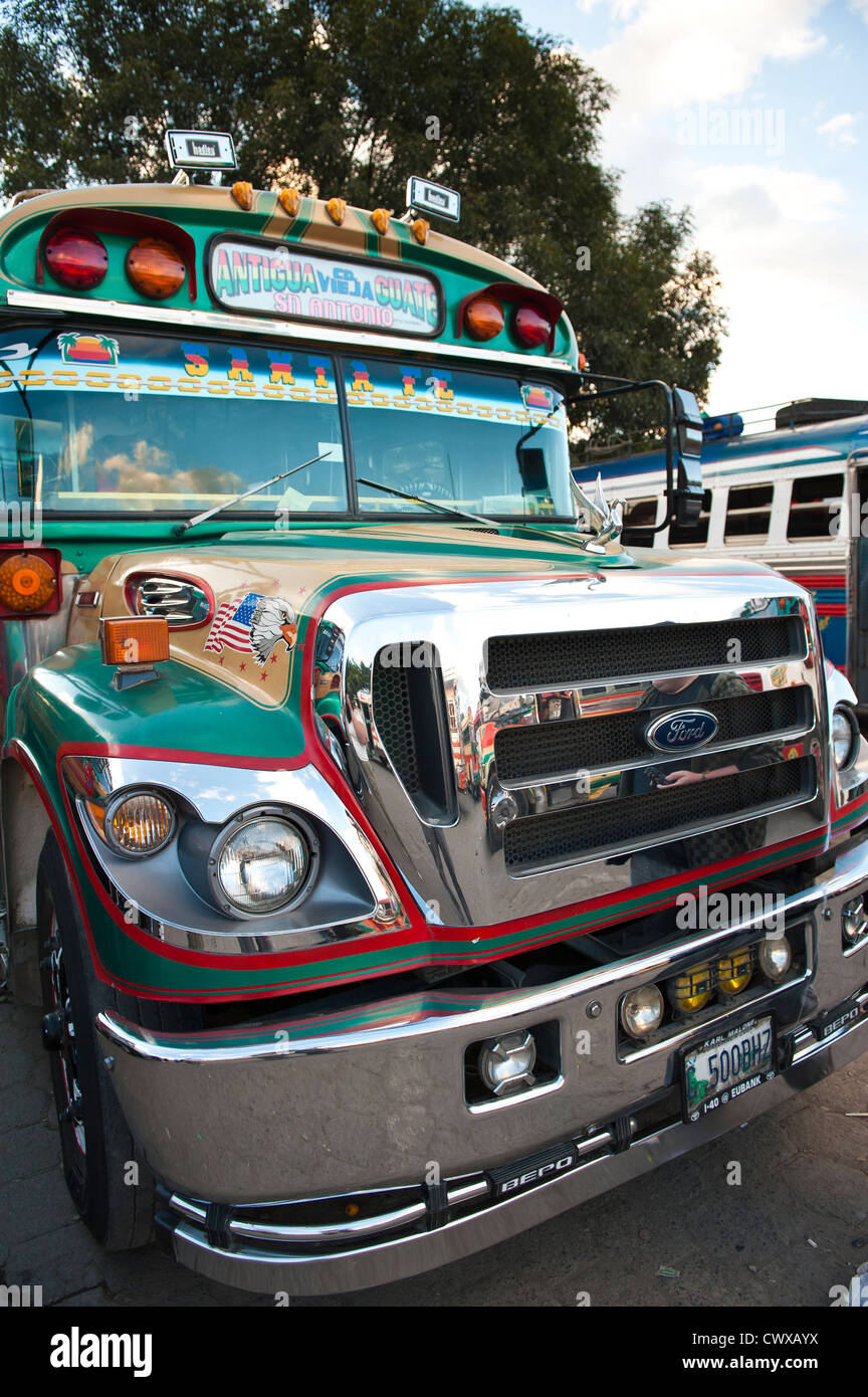 Guatemala, Antigua. Chicken buses at main bus station Stock Photo - Alamy