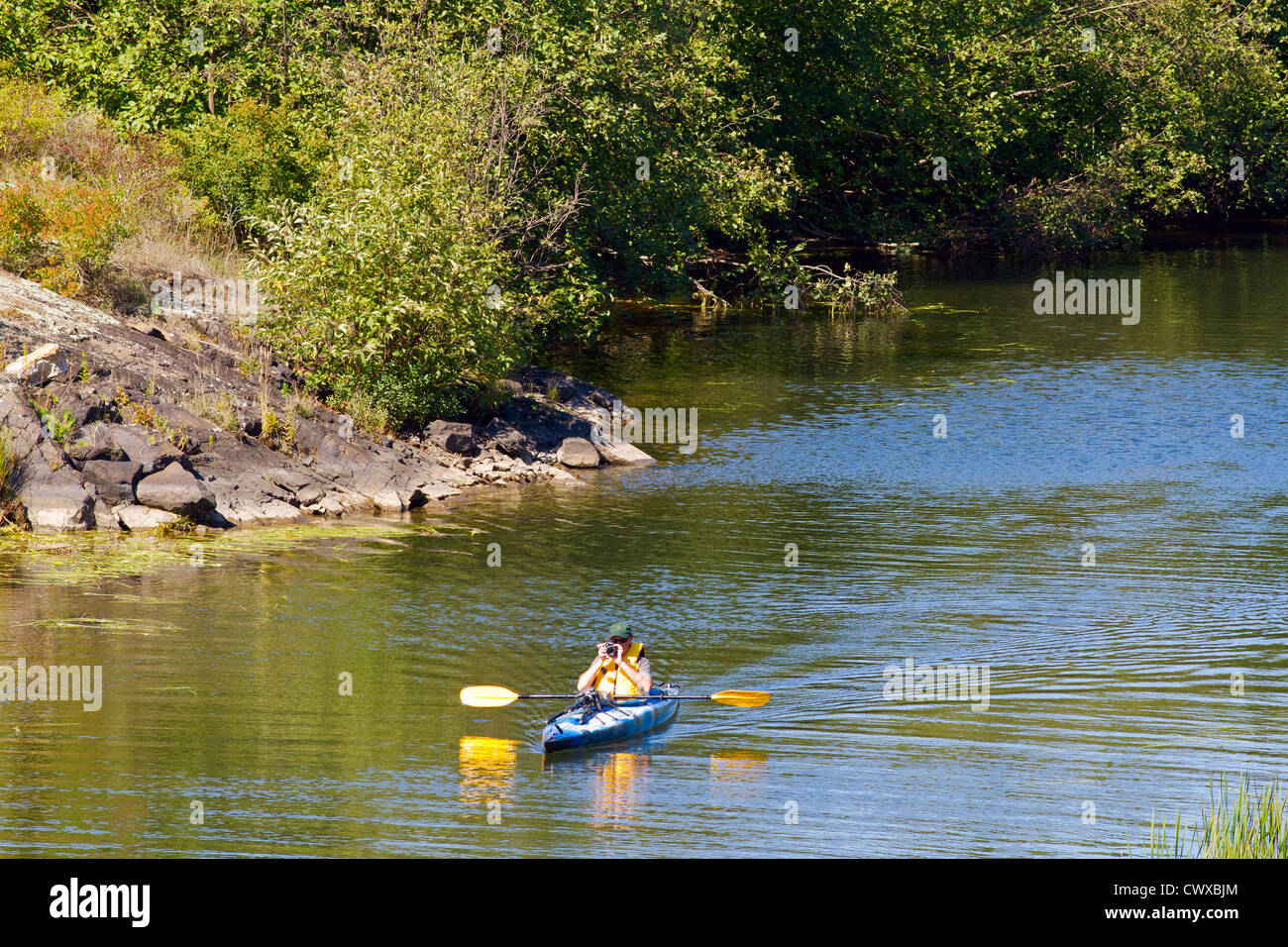 Photographer in a kayak Stock Photo - Alamy