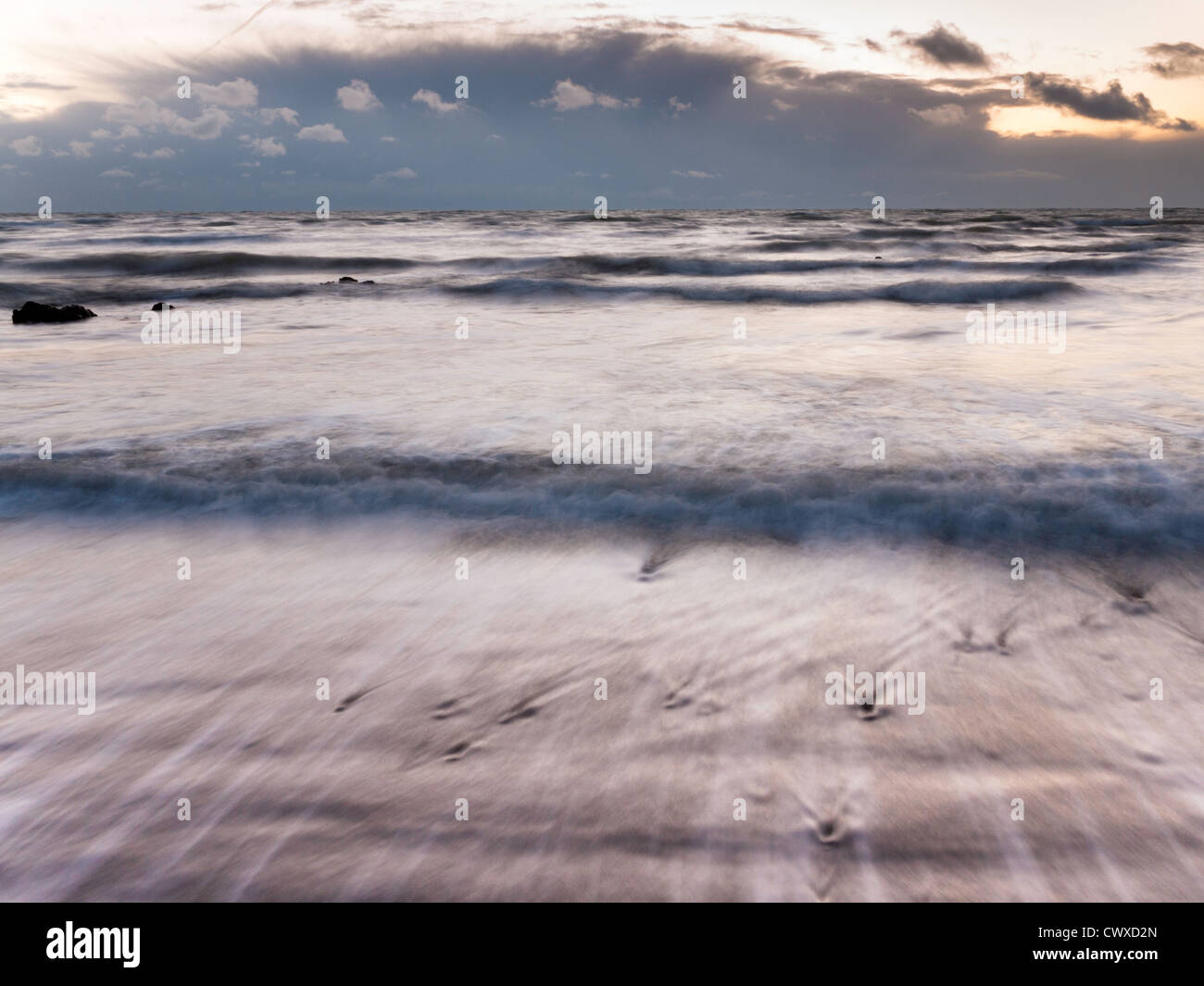 Sunset over Compton Bay on the Isle of Wight, with ominous clouds Stock ...
