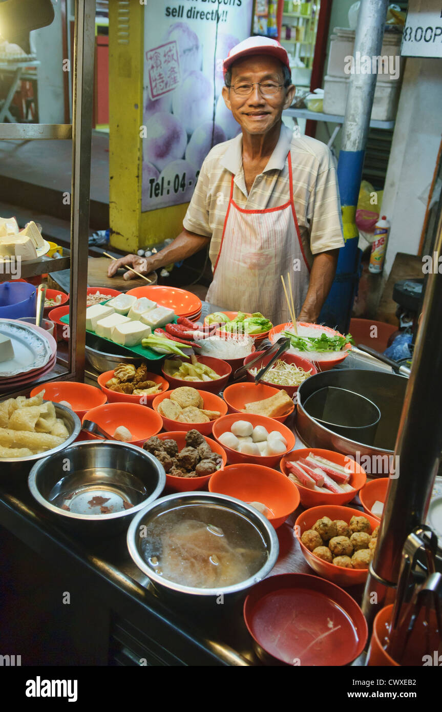 noodles and fishball soup vendor at a hawker court in Penang, Malaysia ...