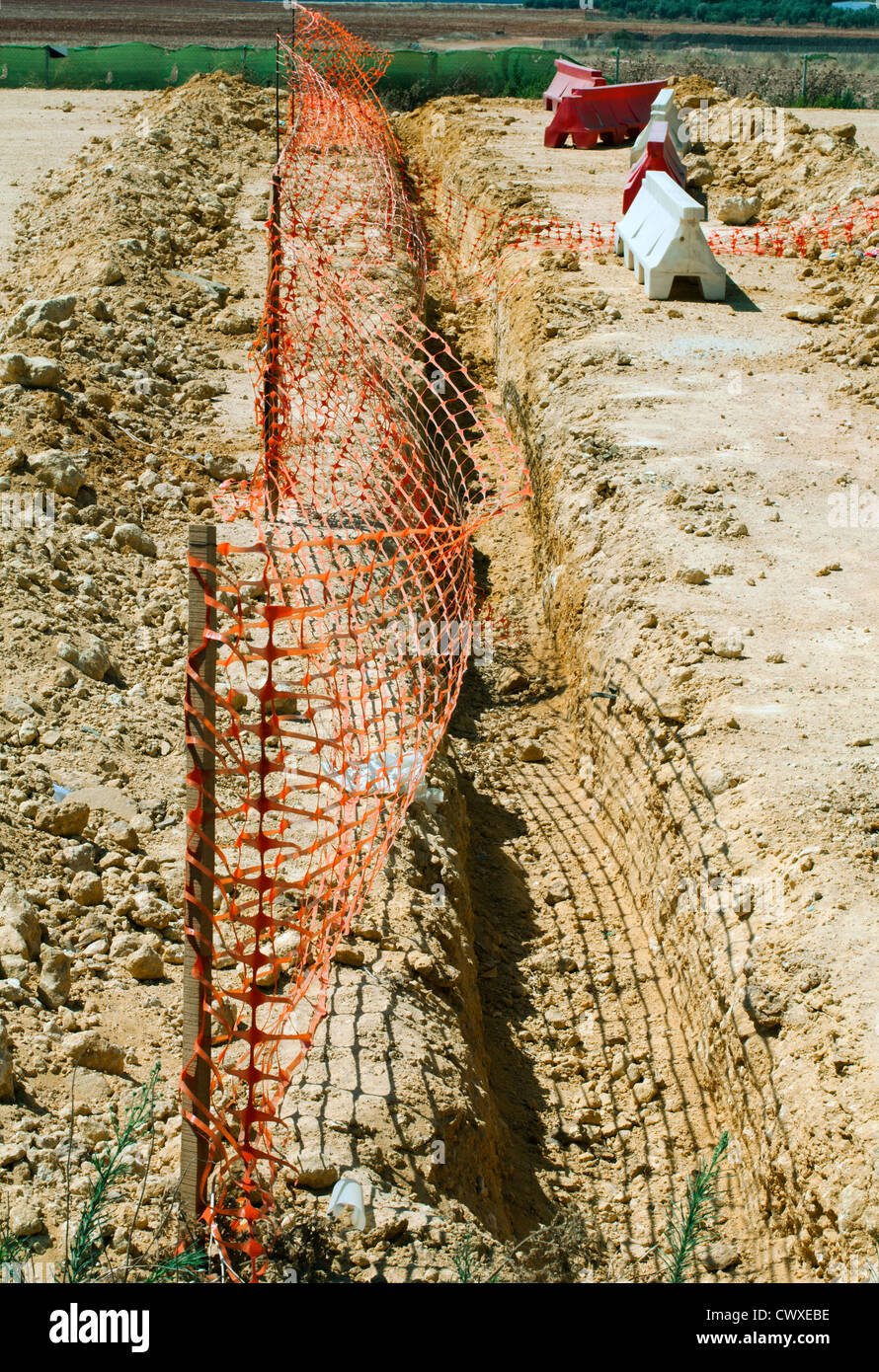Excavated channel for tubes Stock Photo - Alamy