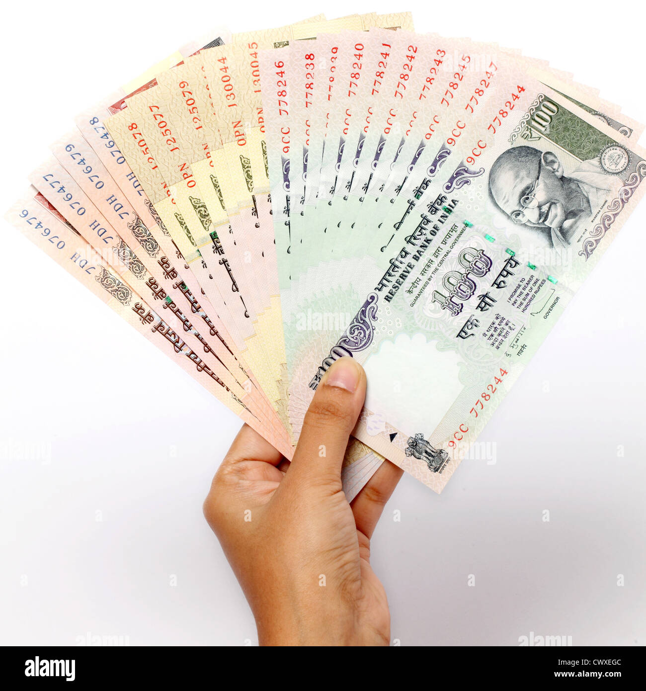Hand holding Indain rupee notes on white background Stock Photo - Alamy