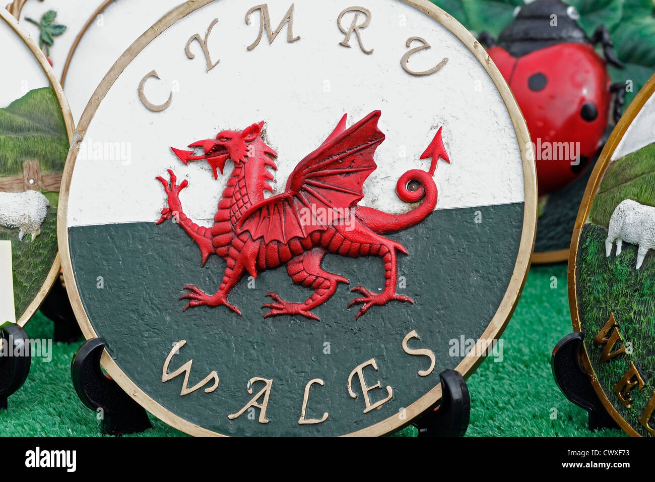 A commemorative plate bearing a Welsh Dragon and the words 'Cymru' and ...