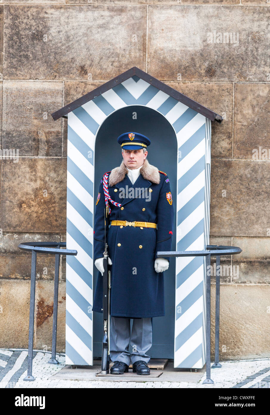 Guard with rifle standing at attention in a sentry box at Prague Castle ...