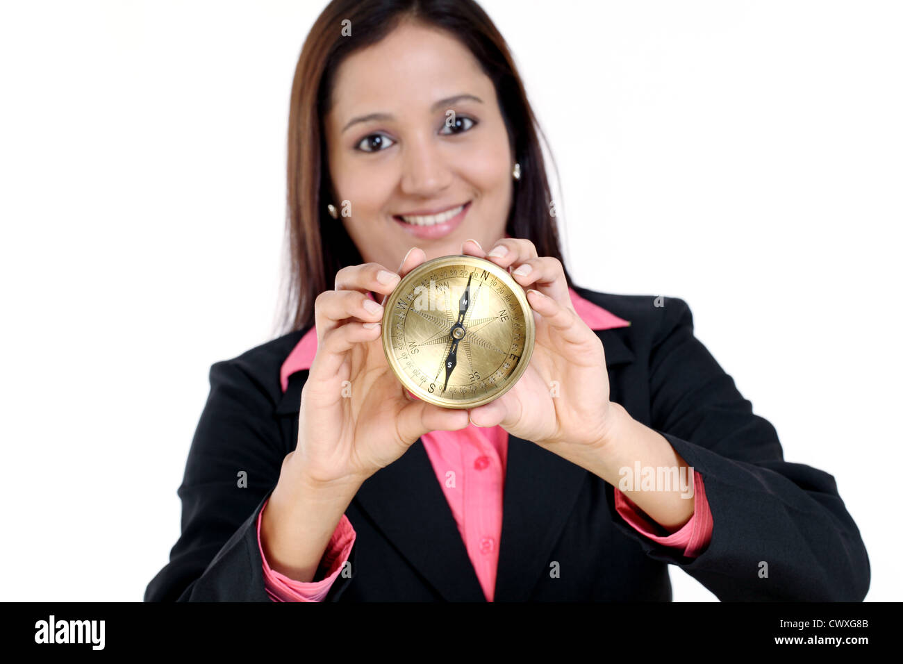 Indian Business woman holding compass against white background Stock ...