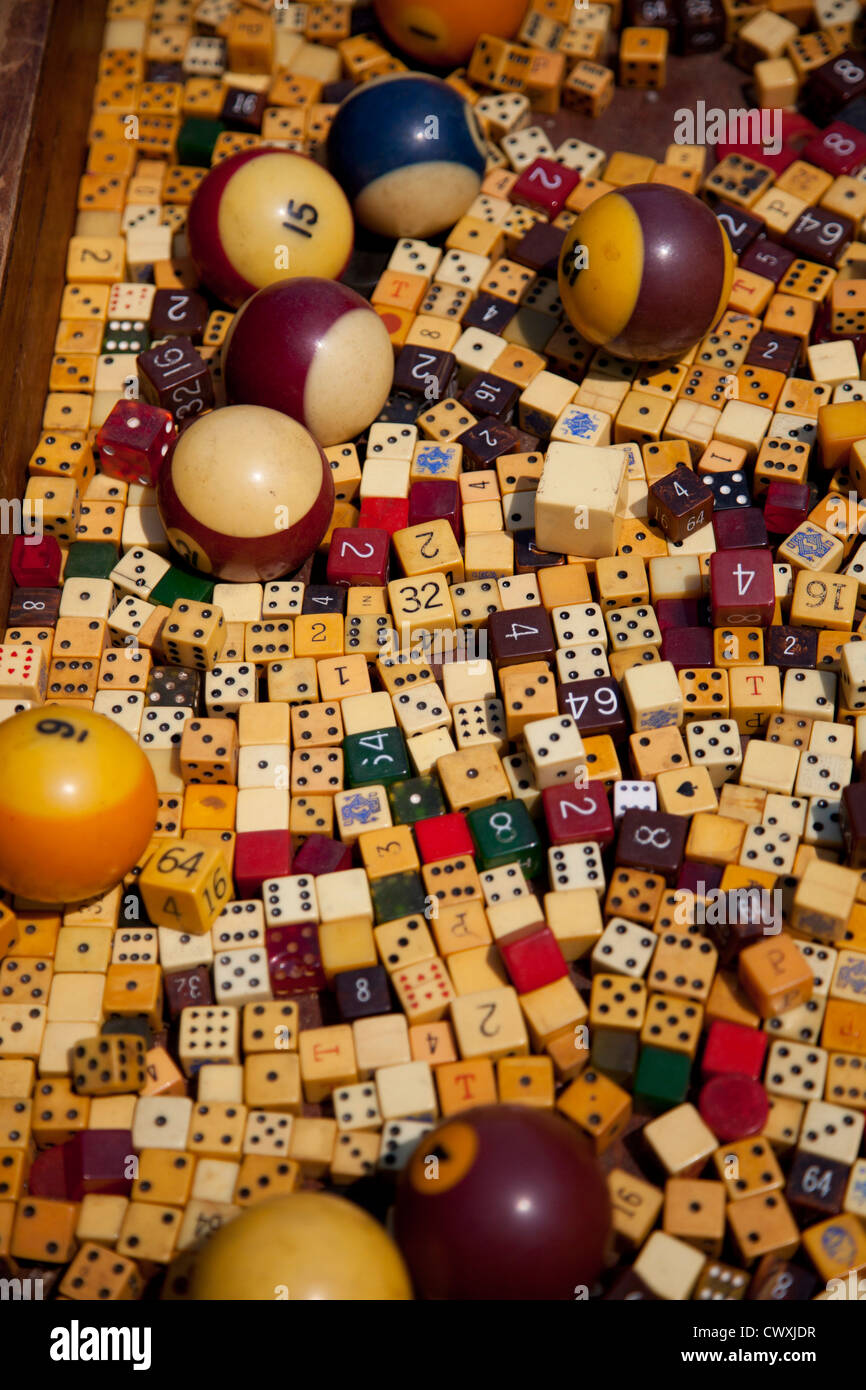 Dice and billiard balls. Still life, frame full of various types of ...