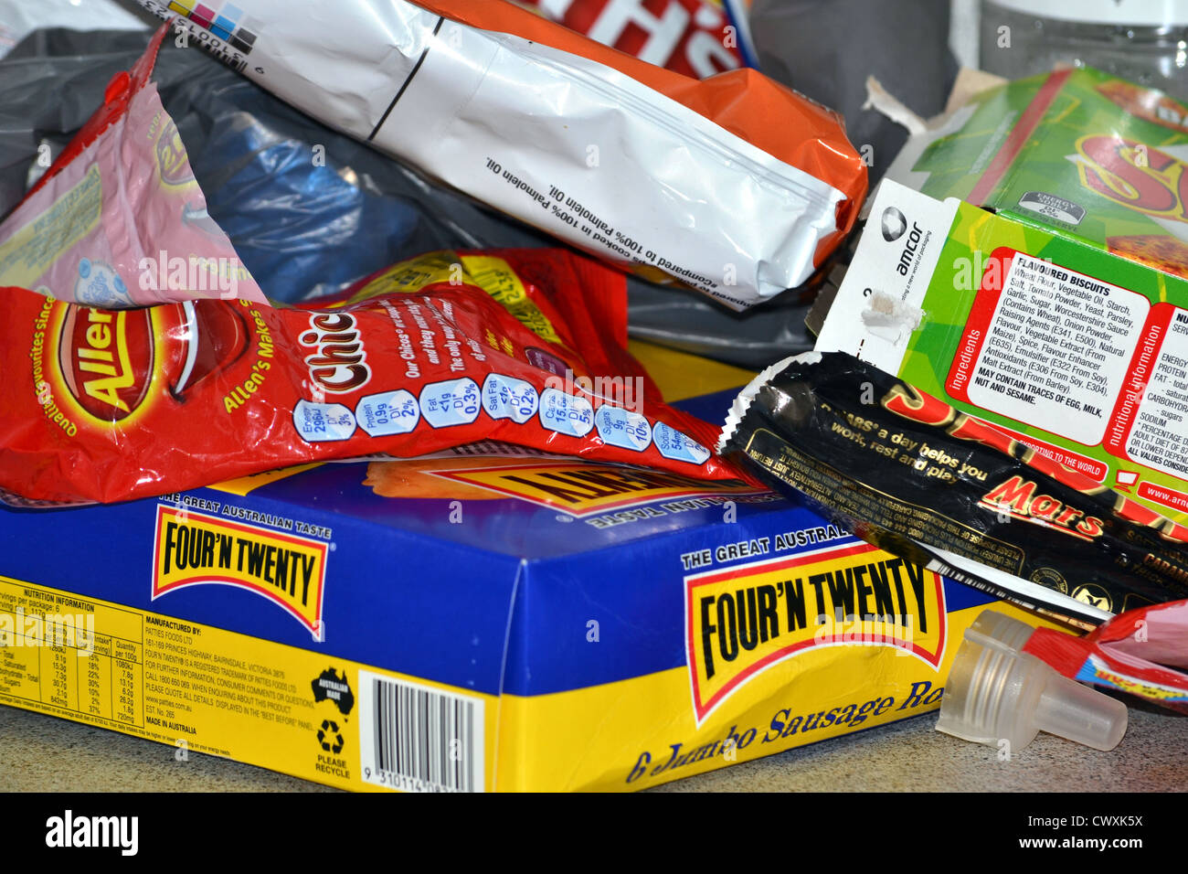 pile of rubbish mostly snack food packaging Stock Photo - Alamy