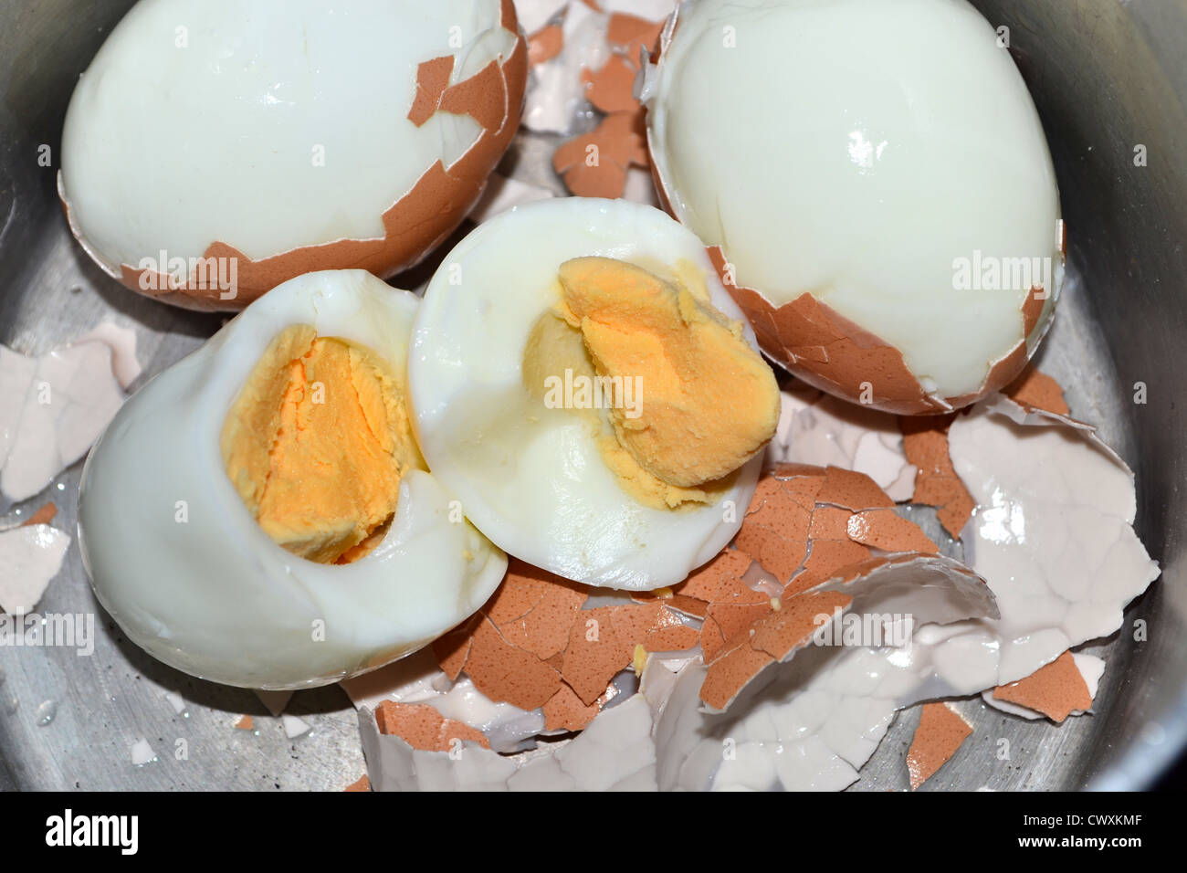 boiled eggs in saucepan with shells Stock Photo - Alamy