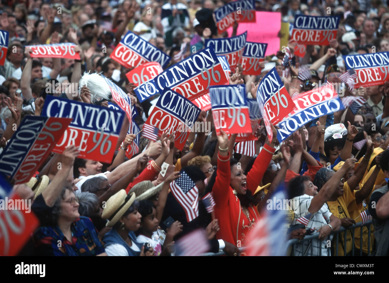 President Bill Clinton supports wave signs during a campaign stop for ...