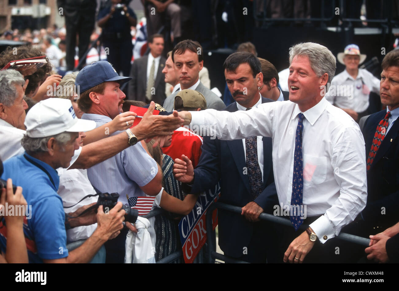 President Bill Clinton shakes hands with supporters during a campaign ...