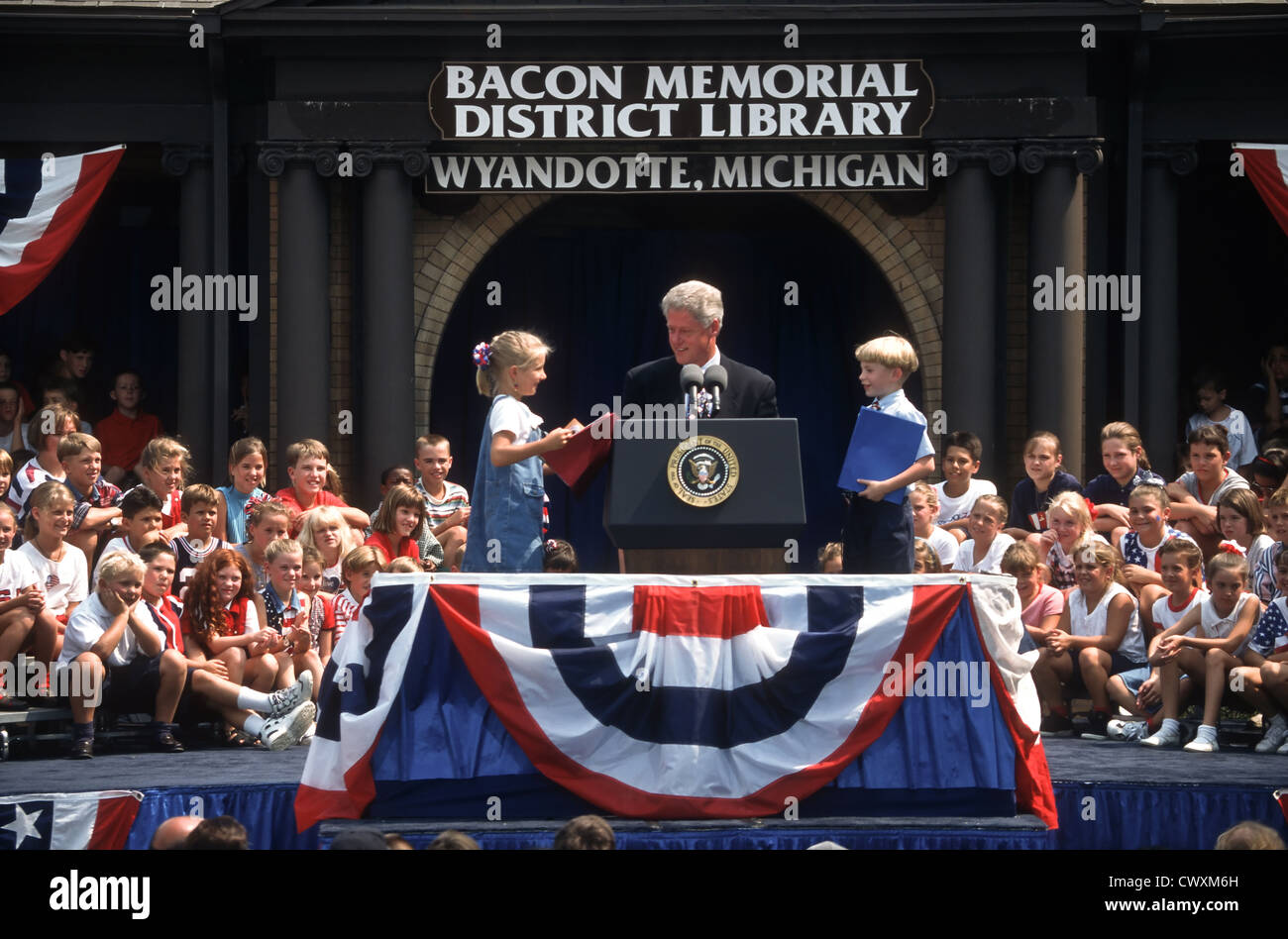 President Bill Clinton is introduced by school children during a ...
