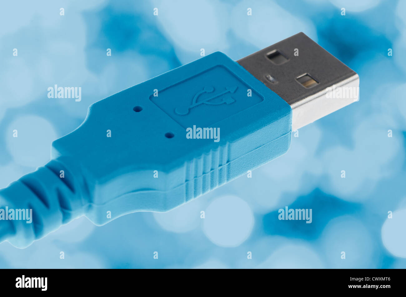 Blue Computer USB cable on blue background Stock Photo - Alamy