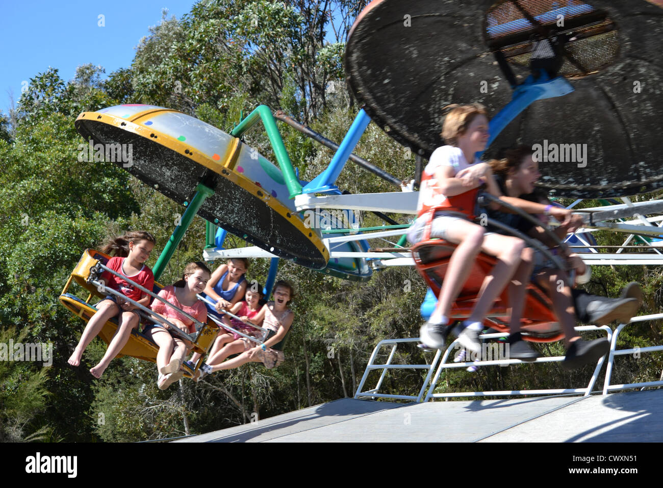 Children on the "Alien Invader" ride at carnival Stock Photo - Alamy