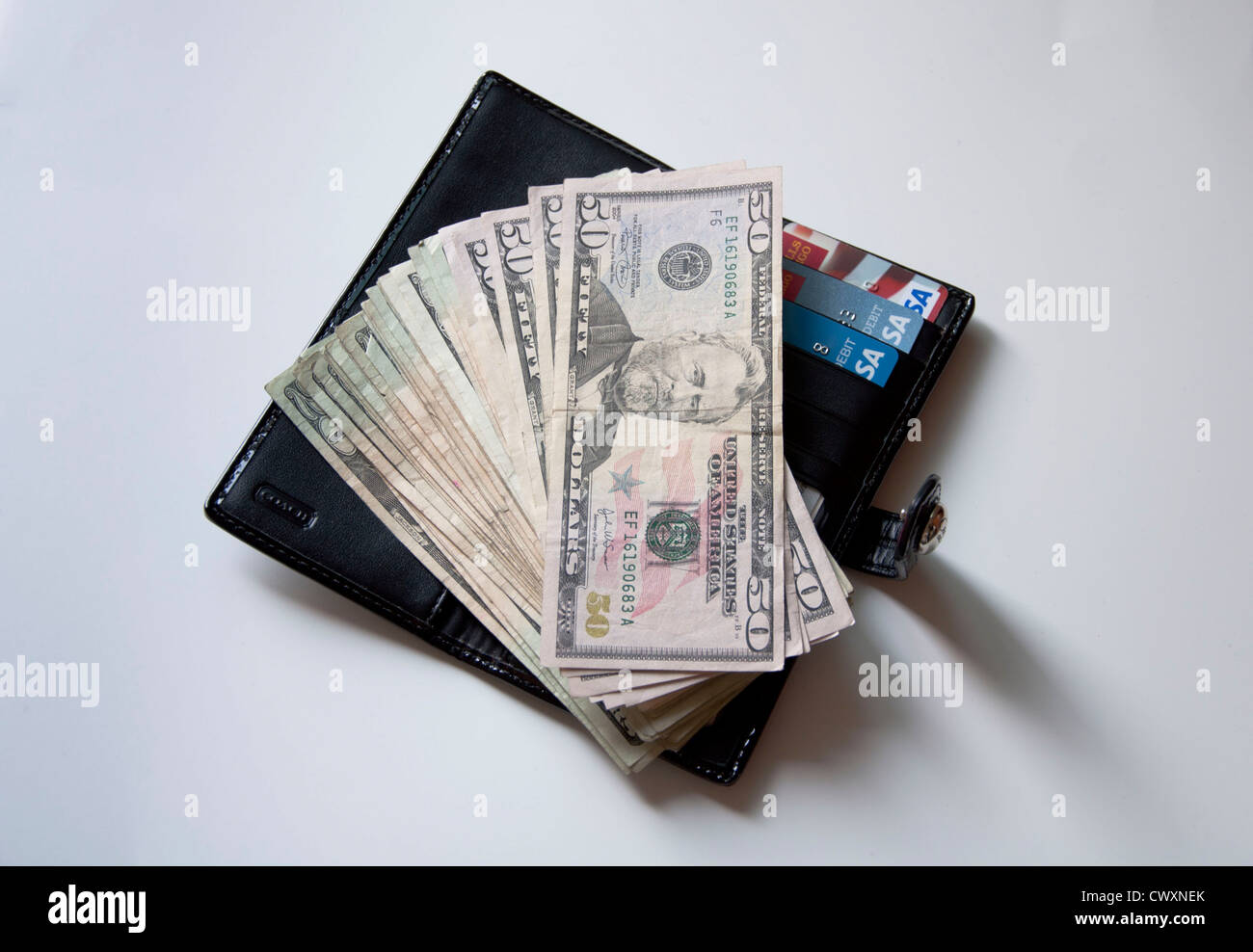 Money and credit cards in wallet Stock Photo - Alamy