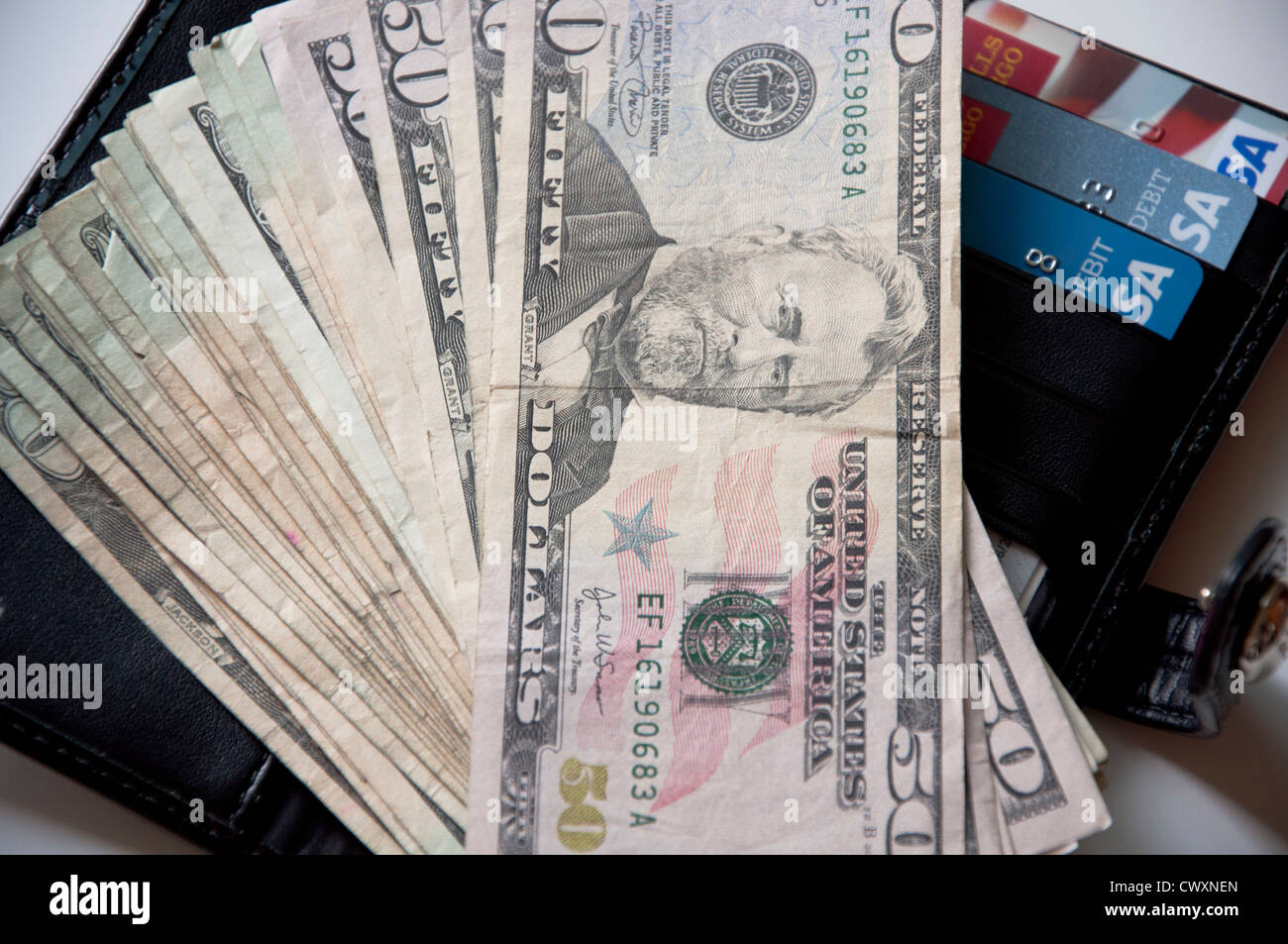 Money and credit cards in wallet Stock Photo - Alamy