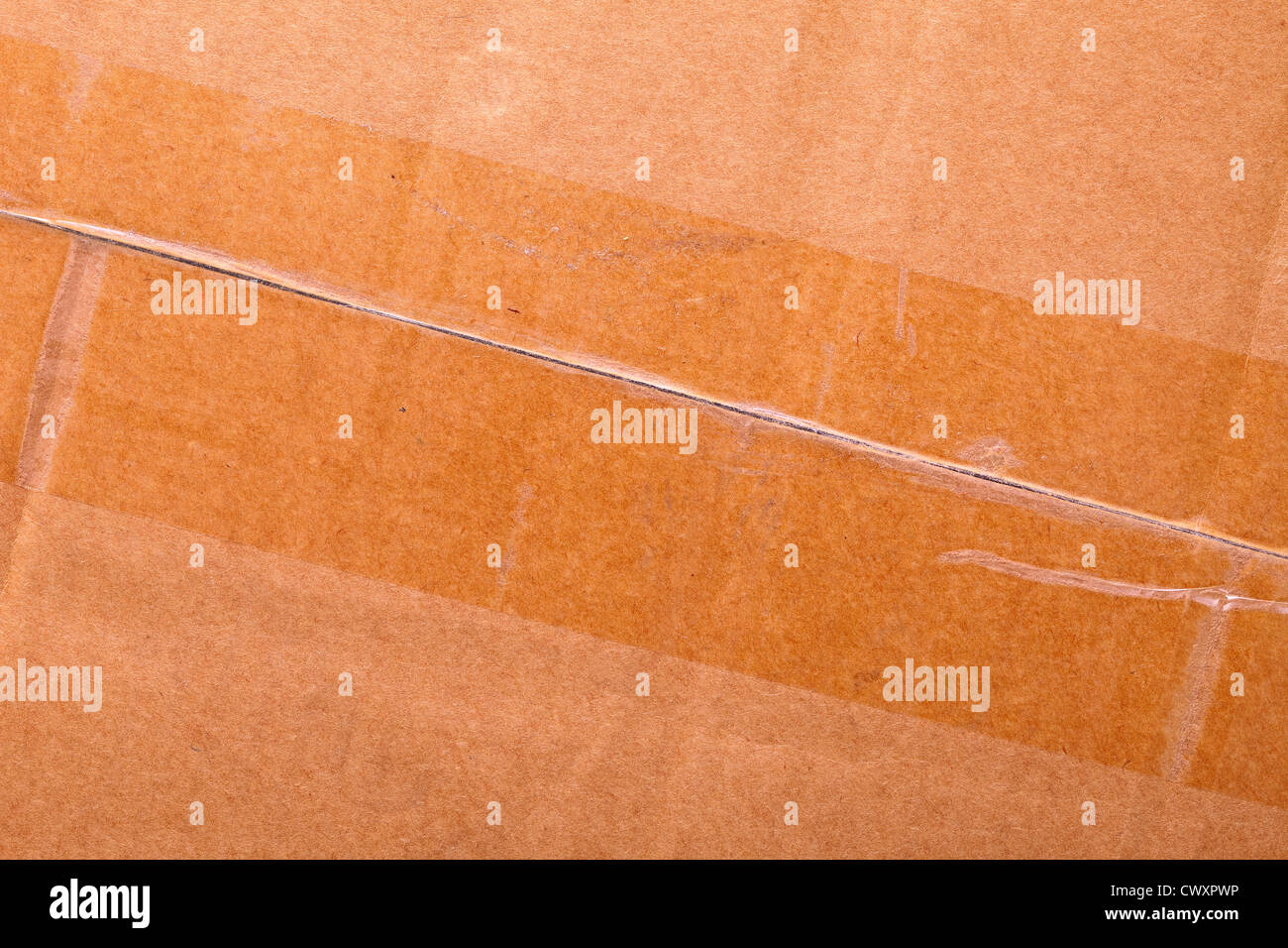 Close up of a cardboard with adhesive tape as background Stock Photo ...