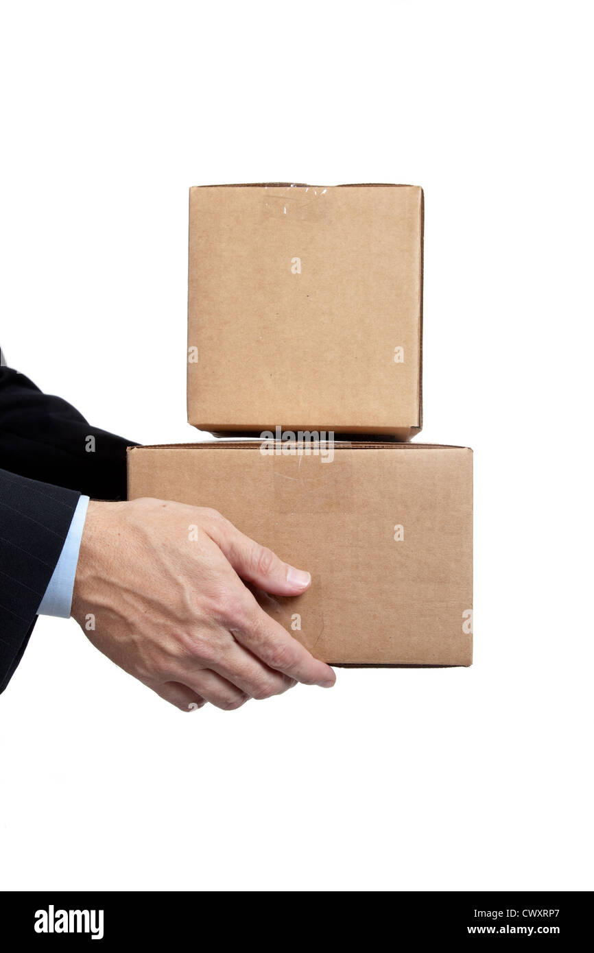 A business man's hand holding two brown packing boxes on a white ...