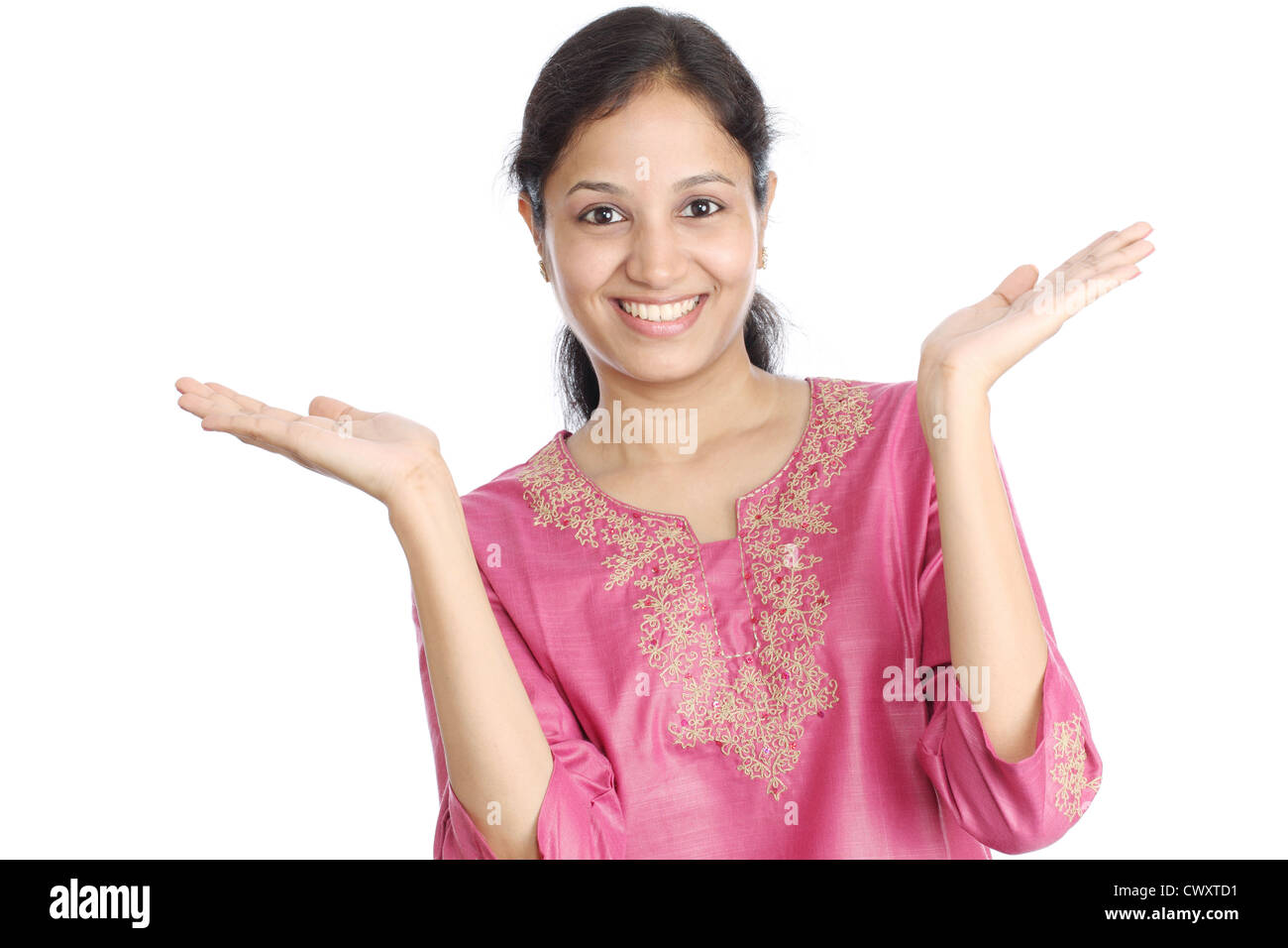 Excited young Indian woman against white background Stock Photo - Alamy