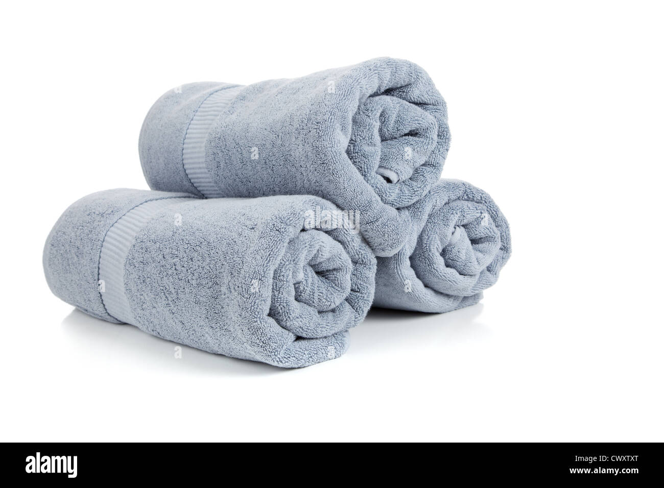A Stack of rolled gray towels on a white background Stock Photo - Alamy
