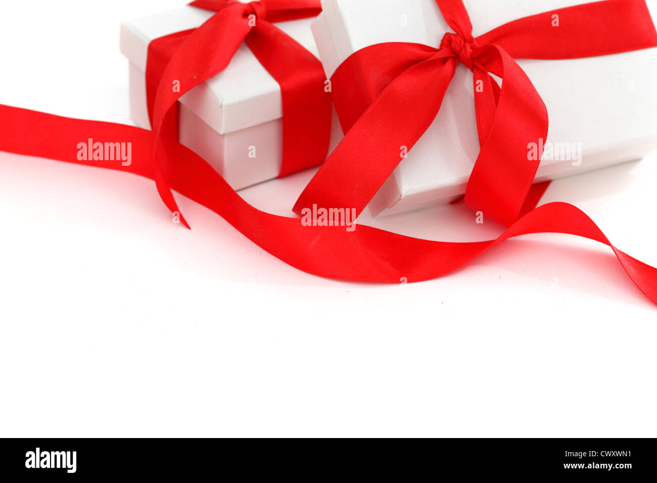 white gift with red ribbon Stock Photo - Alamy