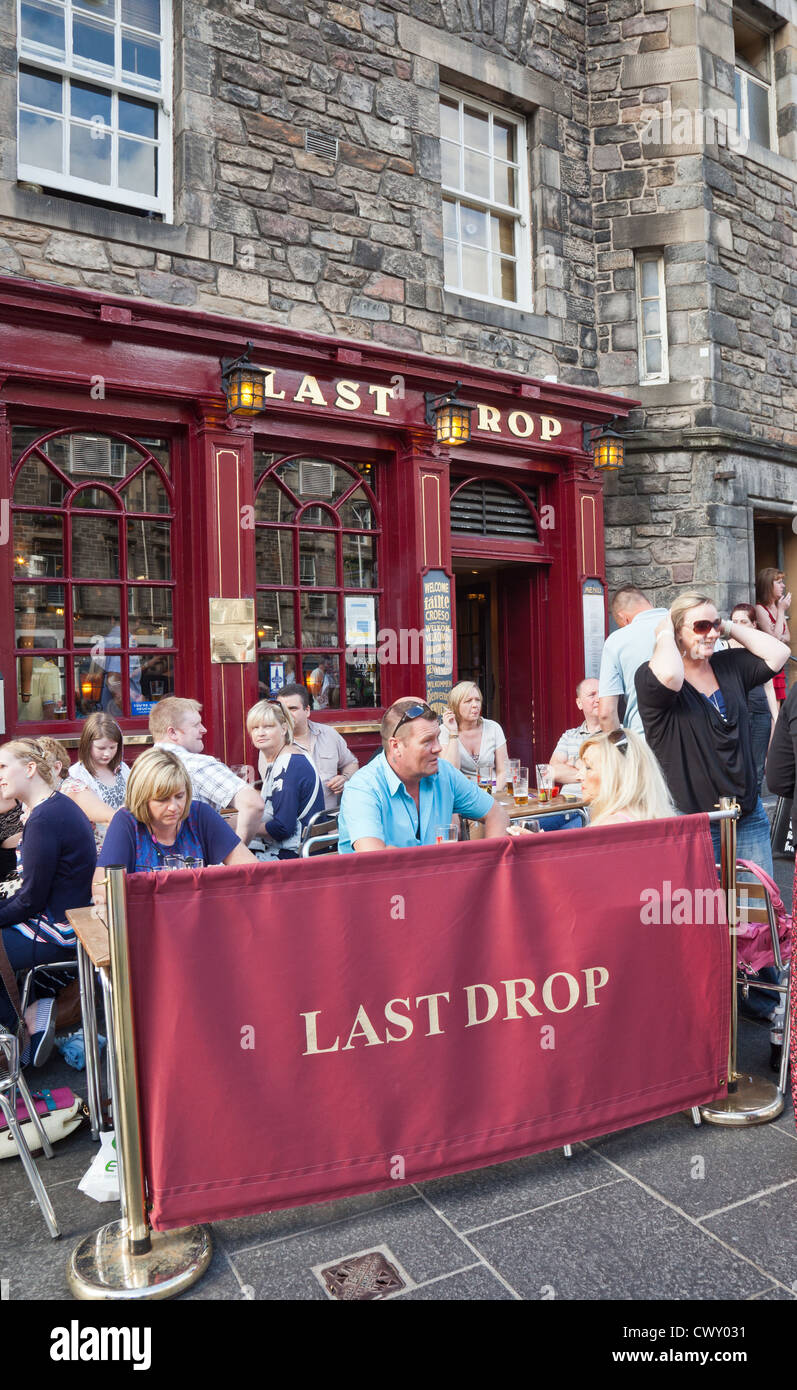 Customers eating outside the Last Drop pub and restaurant, historically ...