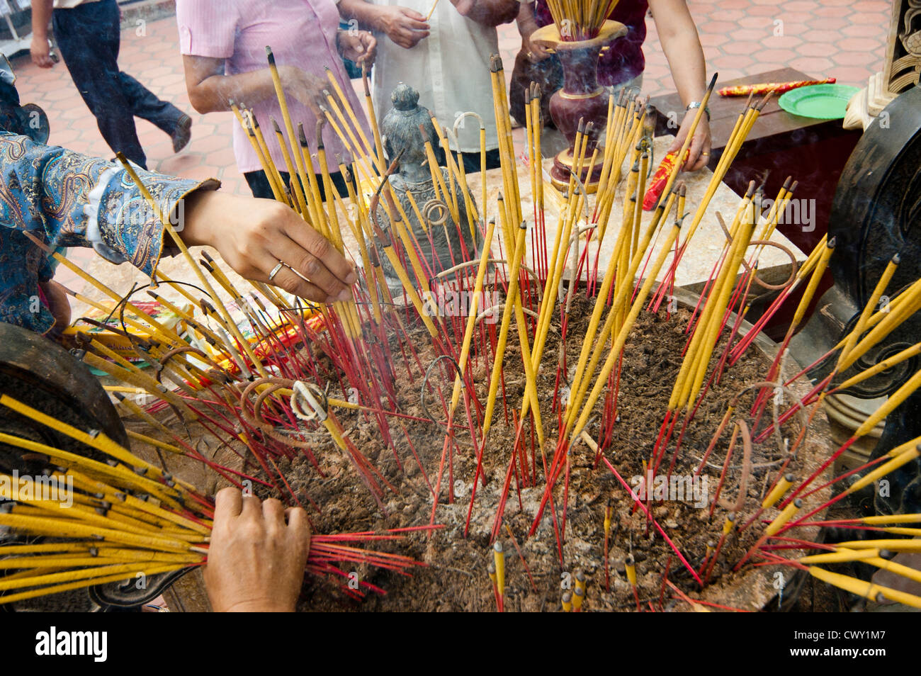 Praying at a temple Stock Photo - Alamy
