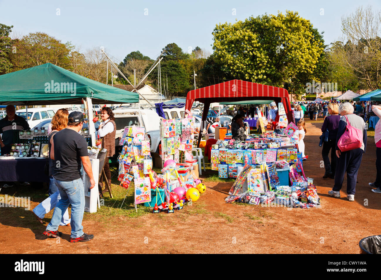 A farmers market on a spring morning with the vendors stalls displaying ...