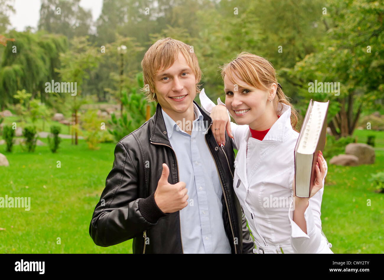Two students studying outdoors Stock Photo - Alamy