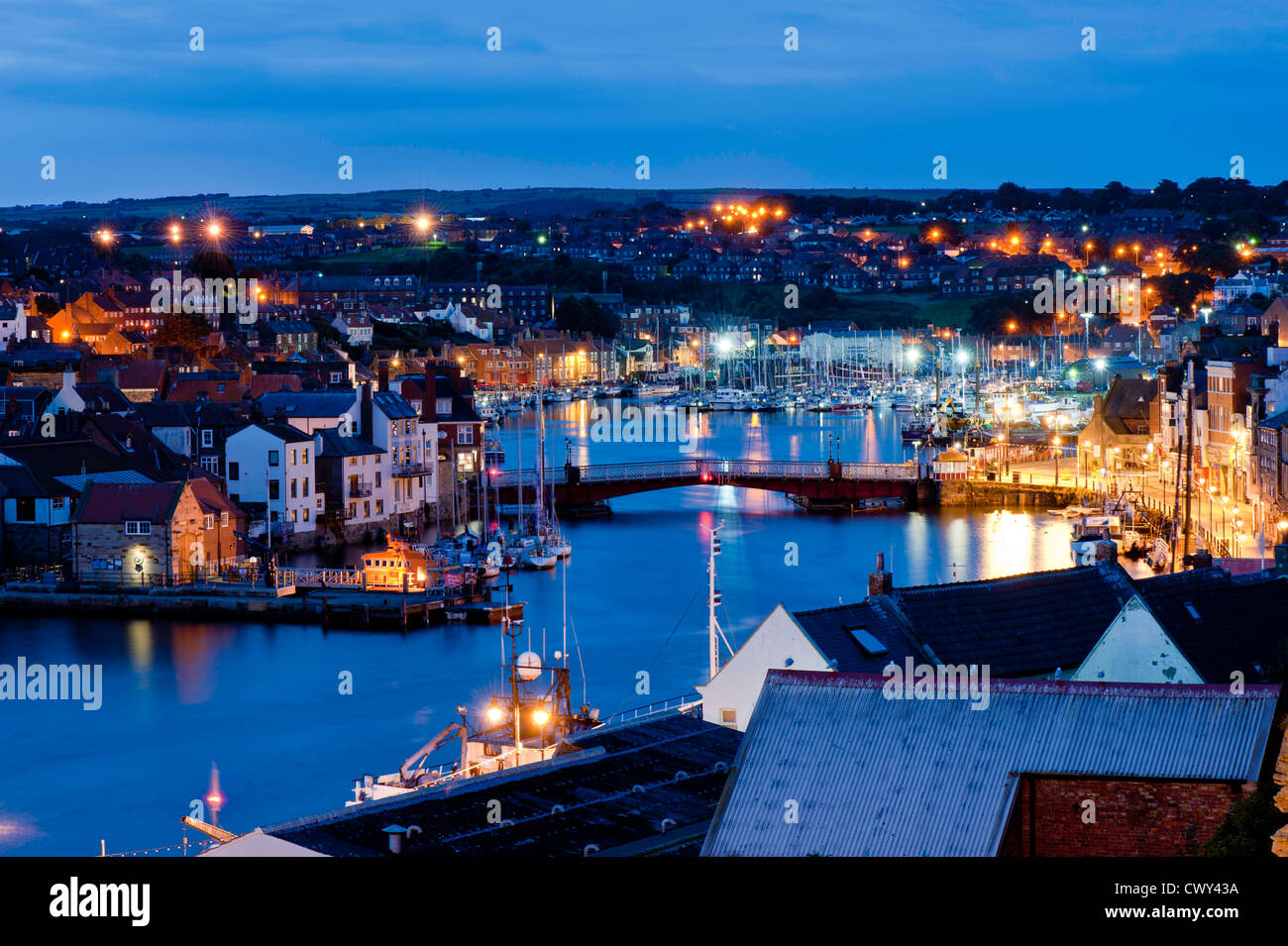 Night time view of town and harbour, Whitby, North Yorkshire, United ...