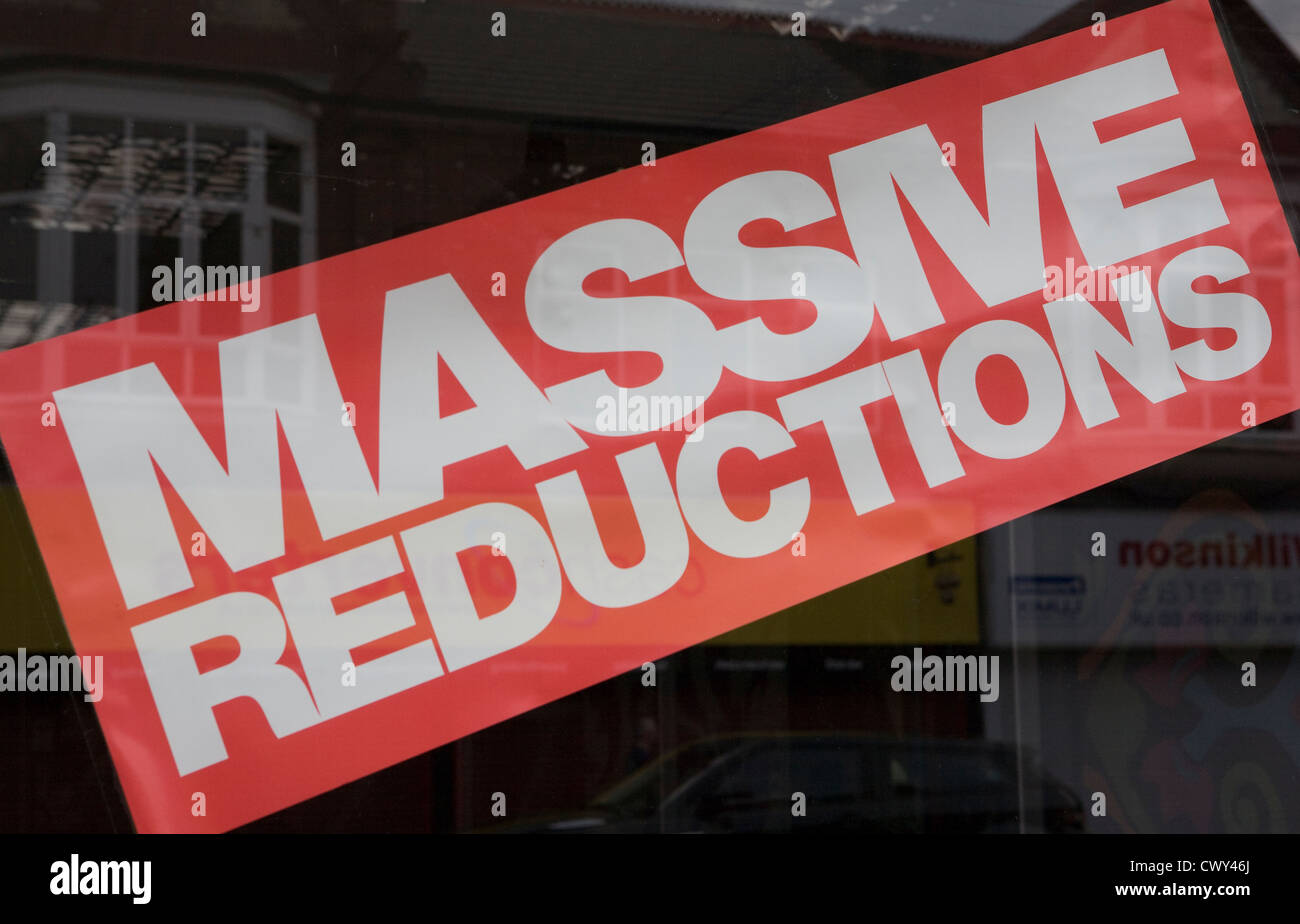Massive Reductions poster in shop window Southport Merseyside Stock ...