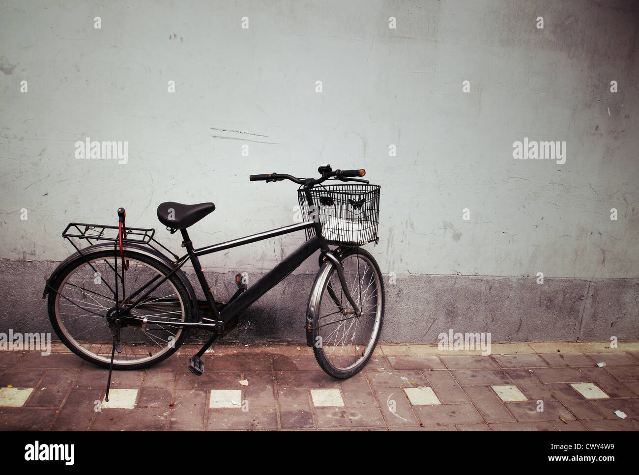 Old Bicycle against a Wall Stock Photo - Alamy