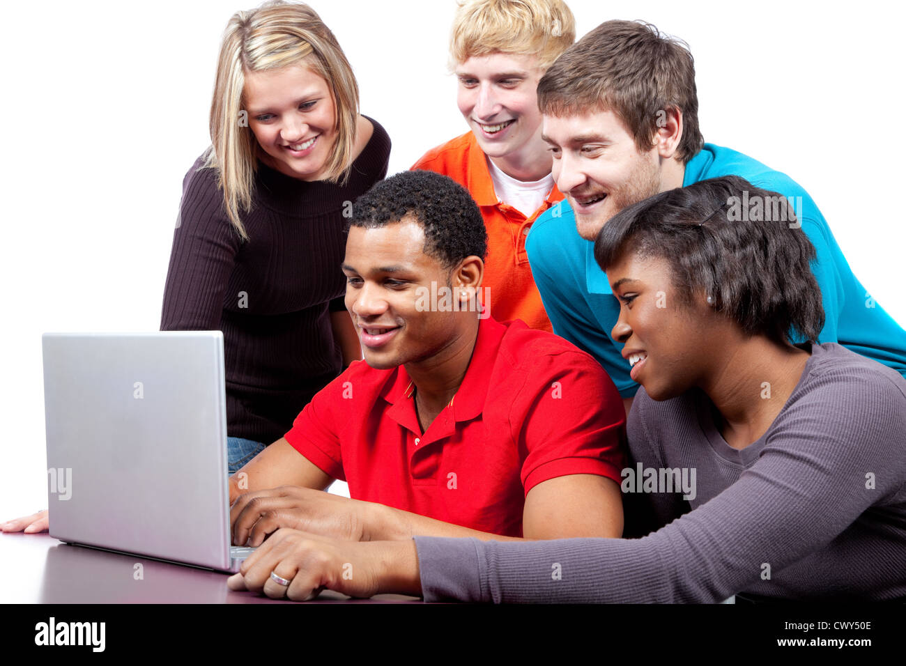 A group of multi-ethnic college students around a computer laptop Stock ...