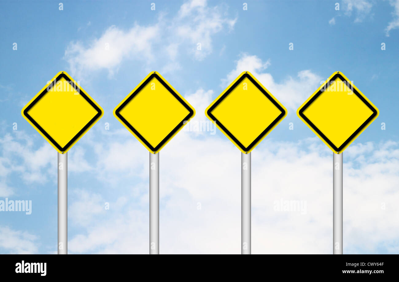 Four blank yellow traffic sign with blue sky Stock Photo - Alamy