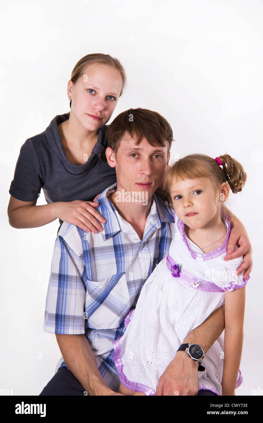 Young European family from three persons - mother, father and daughter ...