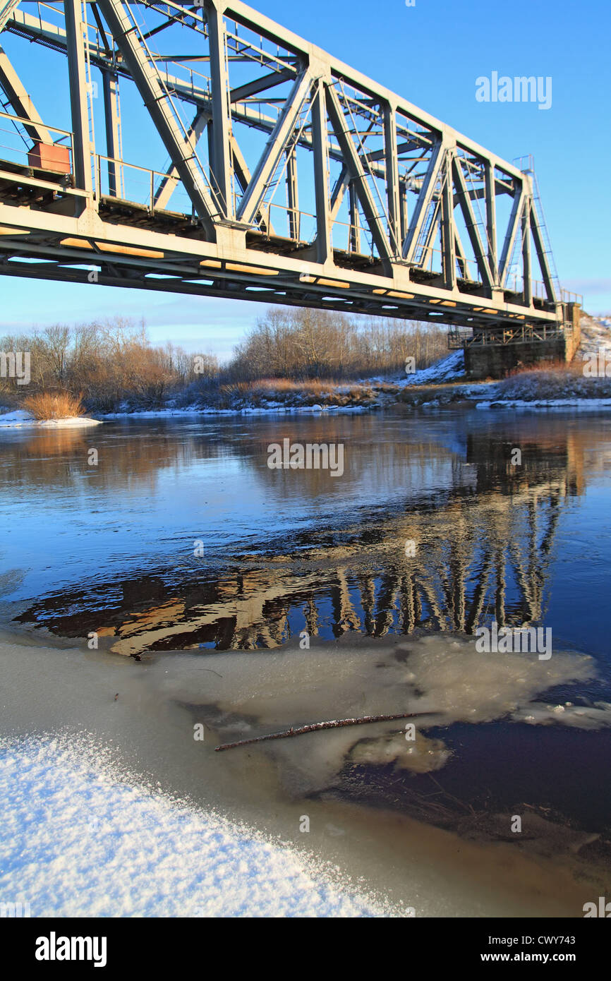 railway bridge through small river Stock Photo - Alamy