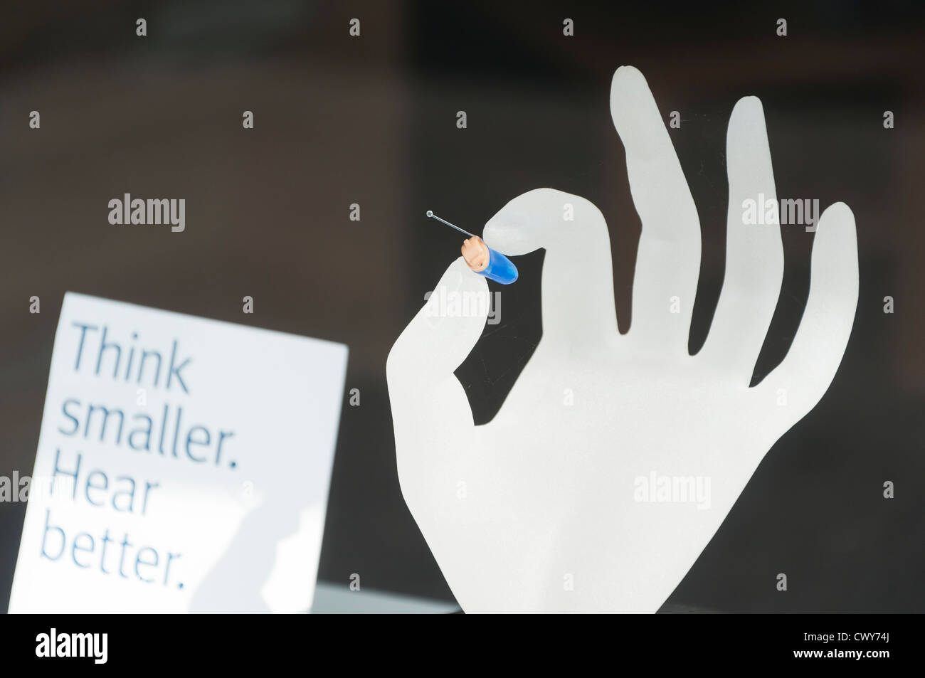 Digital hearing aid displayed in a shop window Stock Photo - Alamy