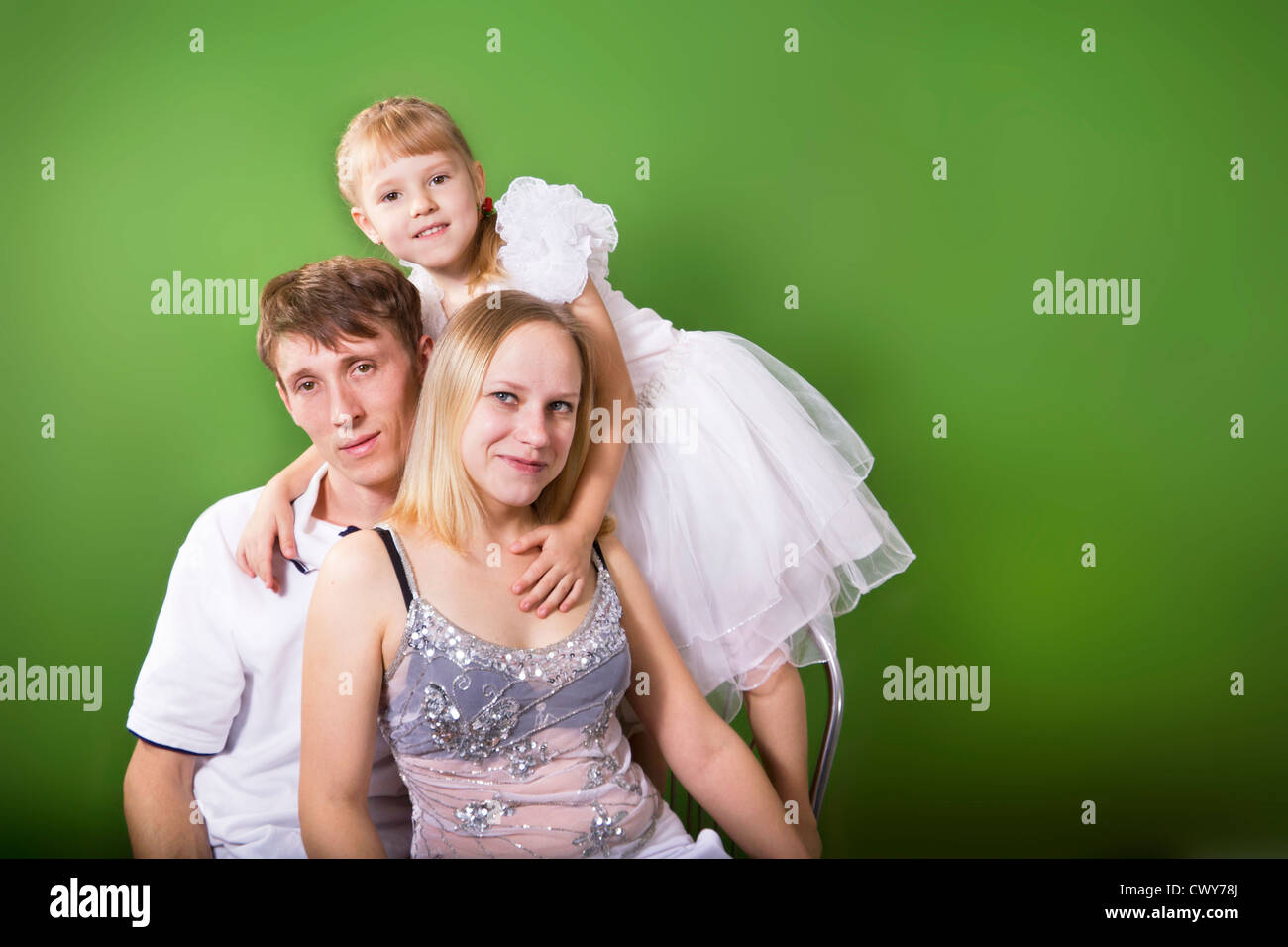 Young European family from three persons - mother, father and daughter ...