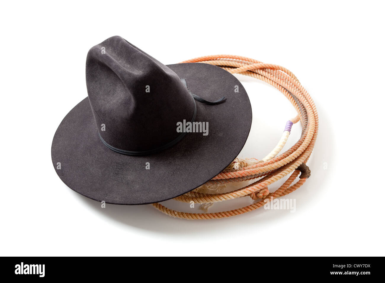 A lasso or lariat rope and a cowboy hat on white background Stock Photo ...