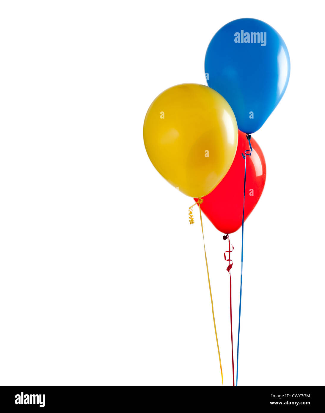 Red, yellow and blue balloons on a white background with copy space ...