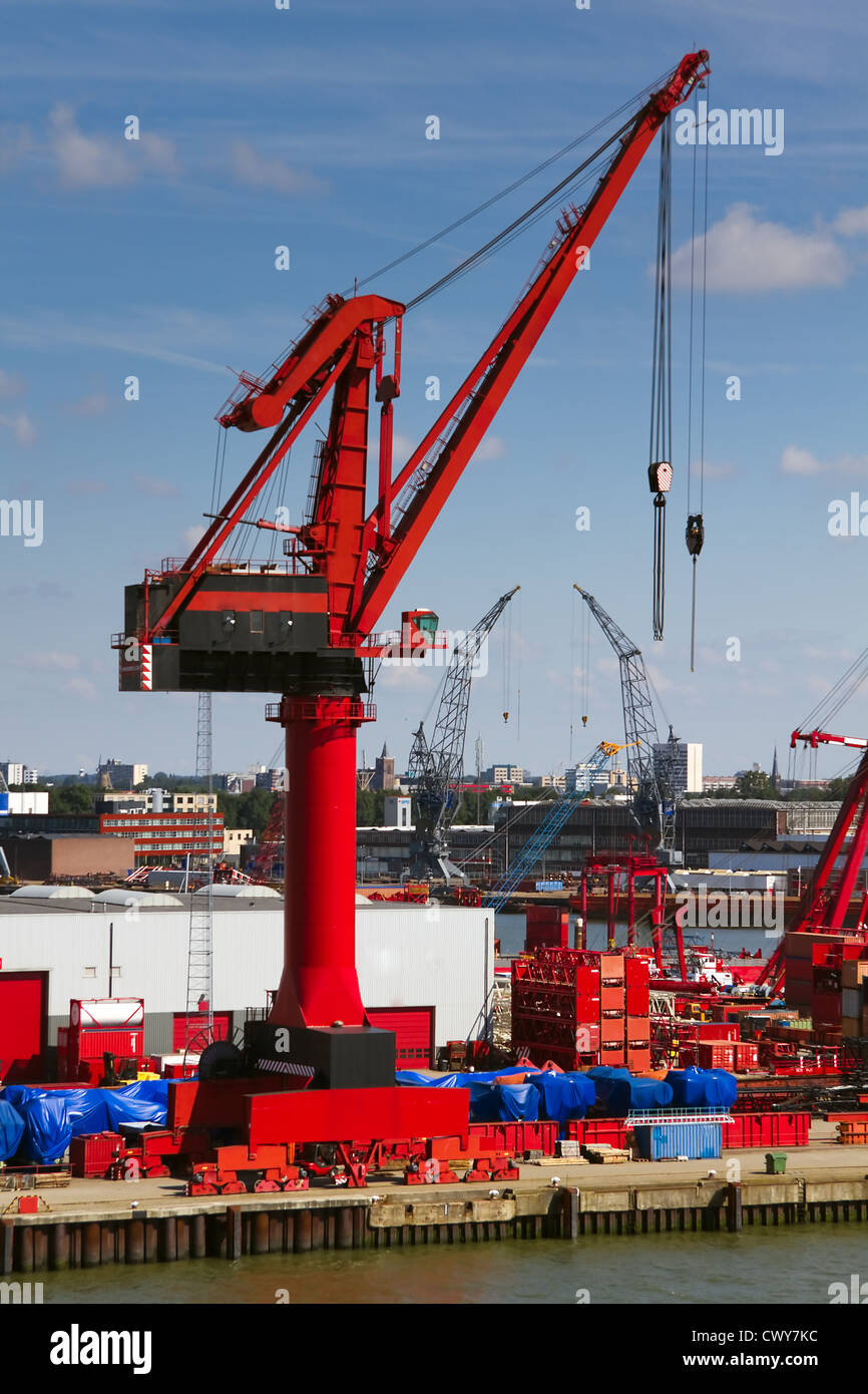 Big red crane in port on sunny day with blue sky background Stock Photo ...