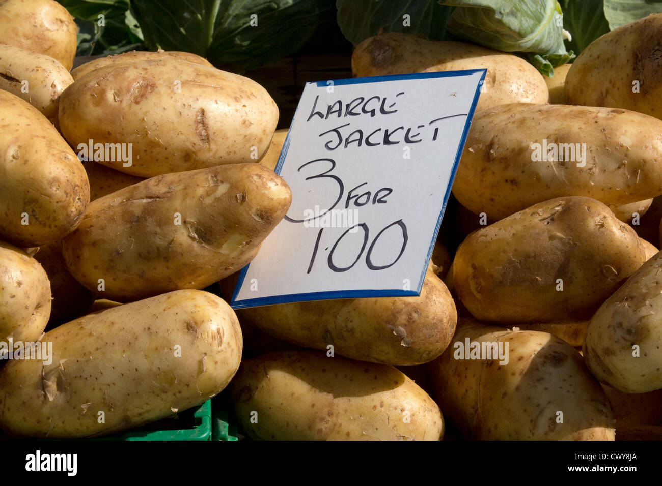 Large Jacket Potatoes for sale on a market stall Stock Photo - Alamy