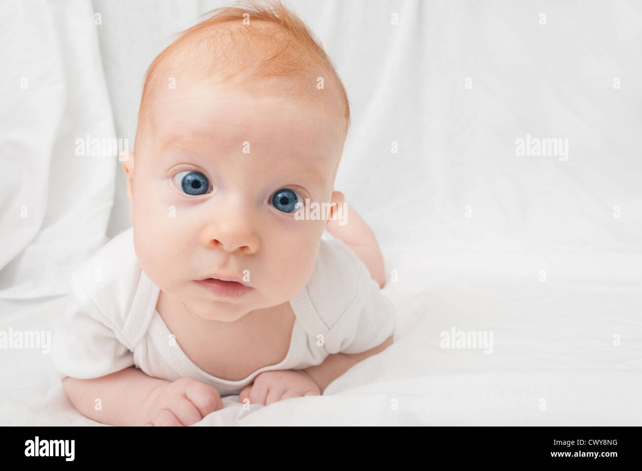Baby cute lying lie girl newborn curious hi-res stock photography and ...